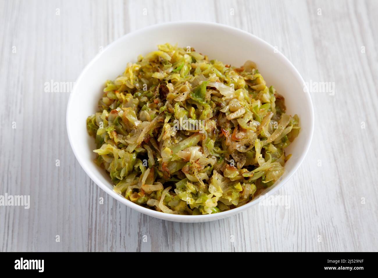 Homemade Irish Sauteed Cabbage in a Bowl, side view Stock Photo - Alamy