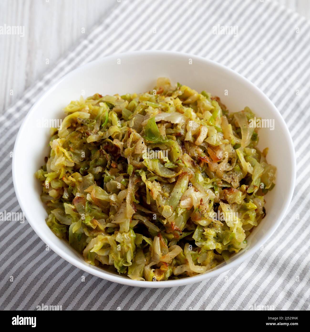 Homemade Irish Sauteed Cabbage in a Bowl, side view Stock Photo - Alamy