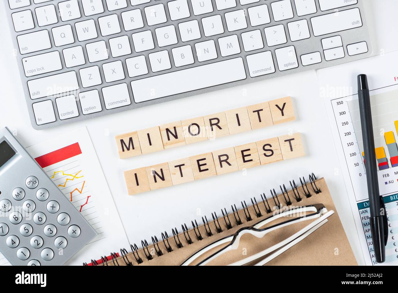 Minority interest concept with letters Stock Photo - Alamy