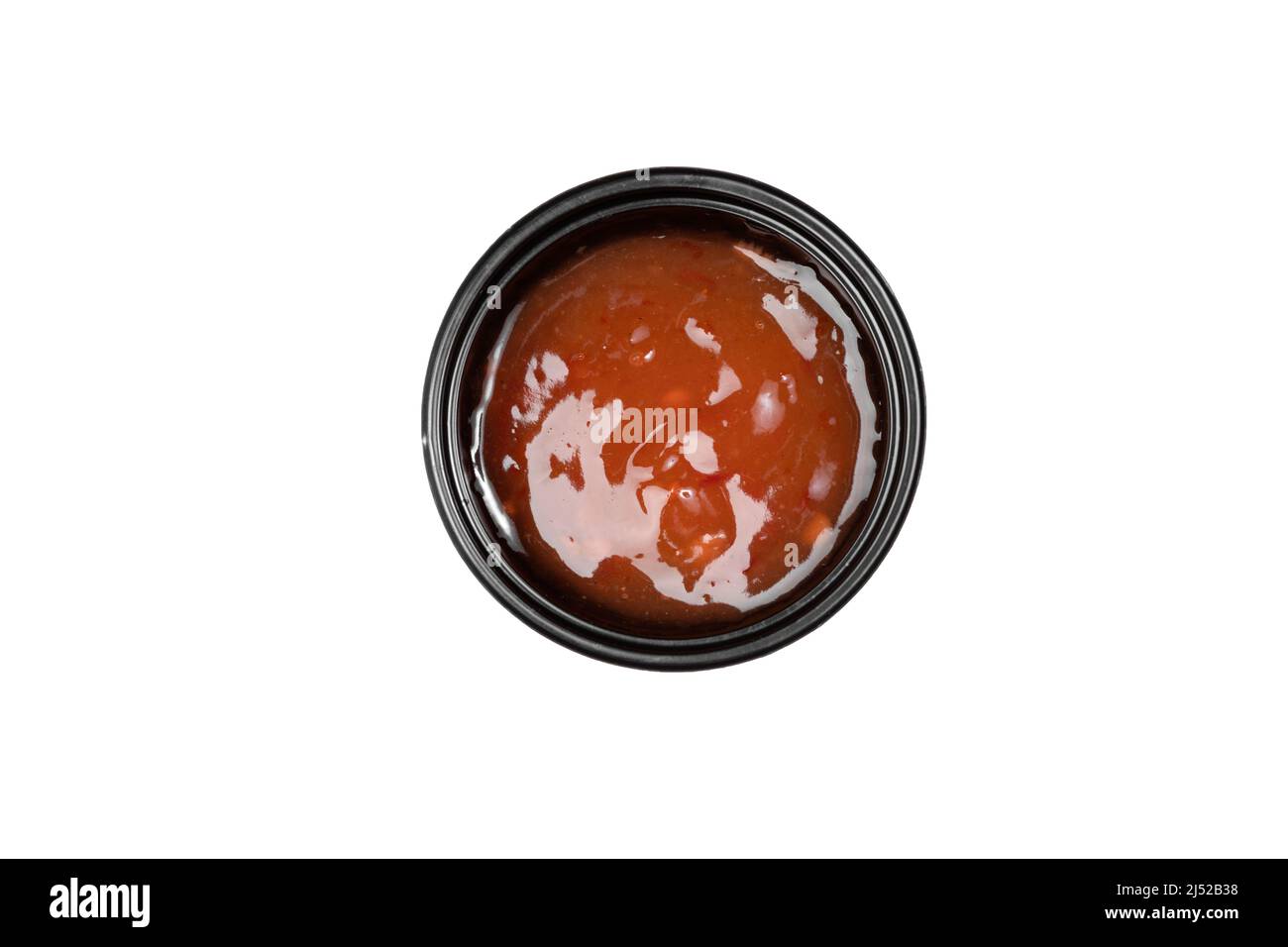 Hot chili sauce black background Cut Out Stock Images & Pictures - Alamy