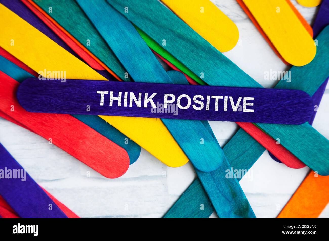 Think positive text on blue wooden stick. Motivational concept Stock ...