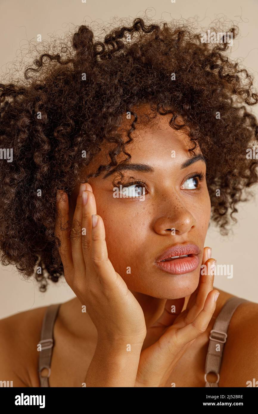 Curly pretty multiracial woman hi-res stock photography and images - Alamy