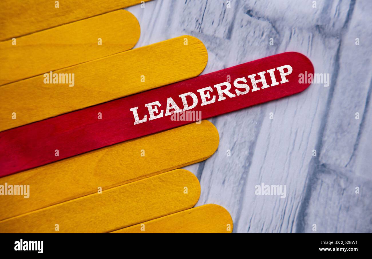 Leadership text on red wooden stick. Business and leadership concept ...