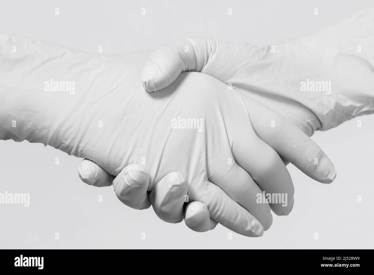 Surgical gloves handshake hi-res stock photography and images - Alamy