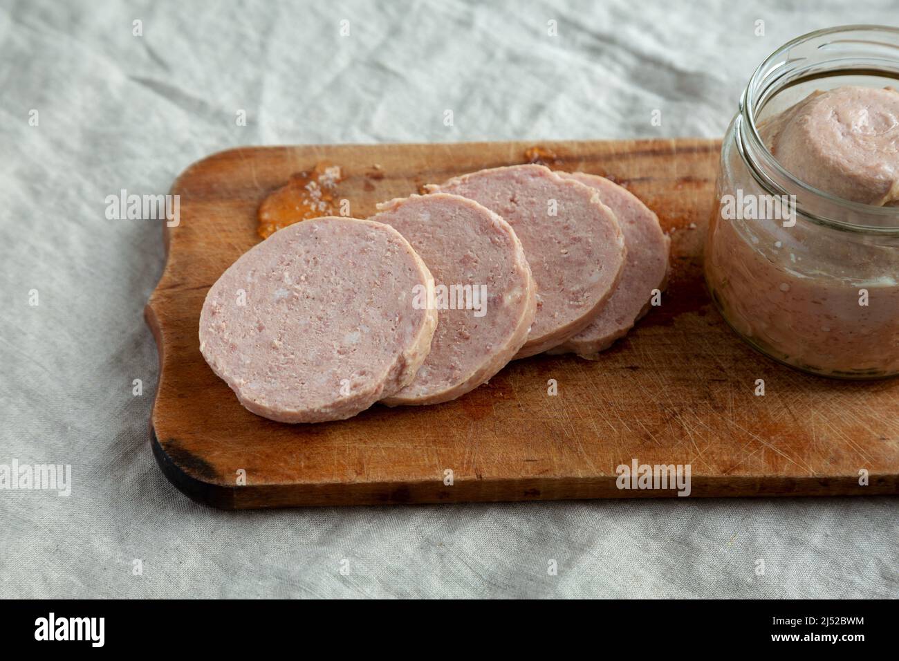 Homemade Jagdwurst on a rustic wooden board, side view. Close-up Stock ...