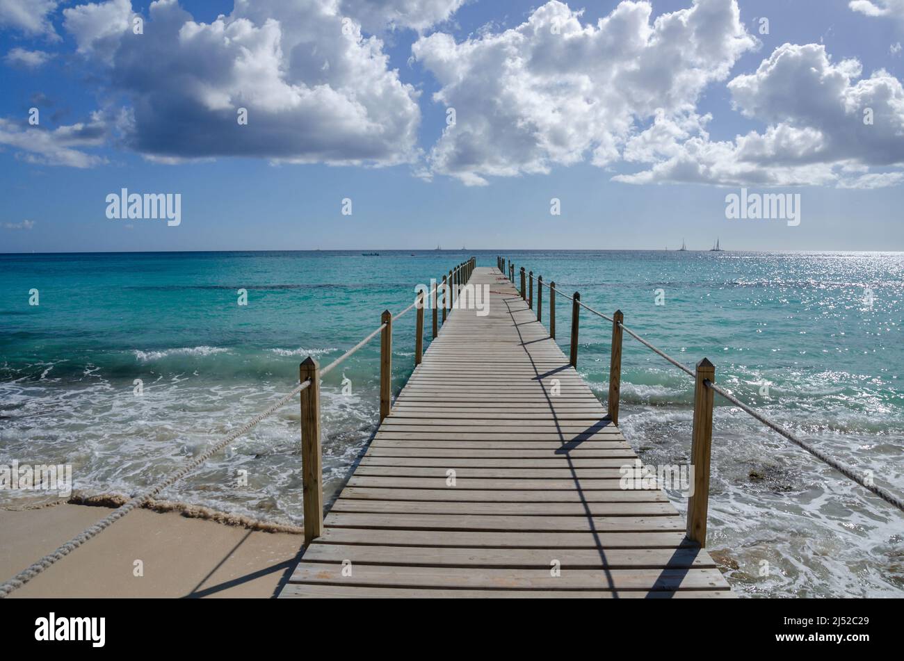 Tropical beach with a pier in the Caribbean Stock Photo - Alamy