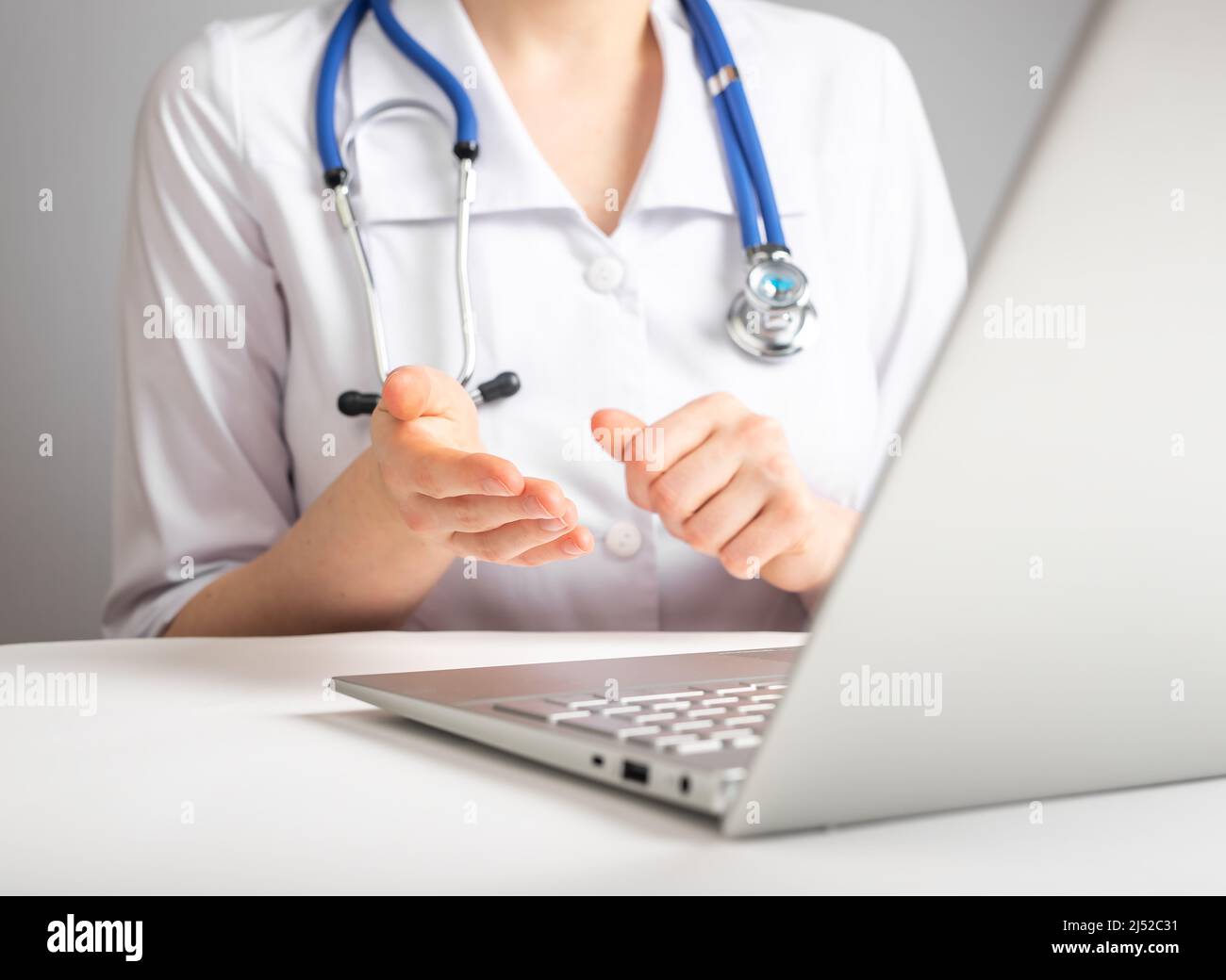 Online medical consultation concept. Doctor with stethoscope speaking ...