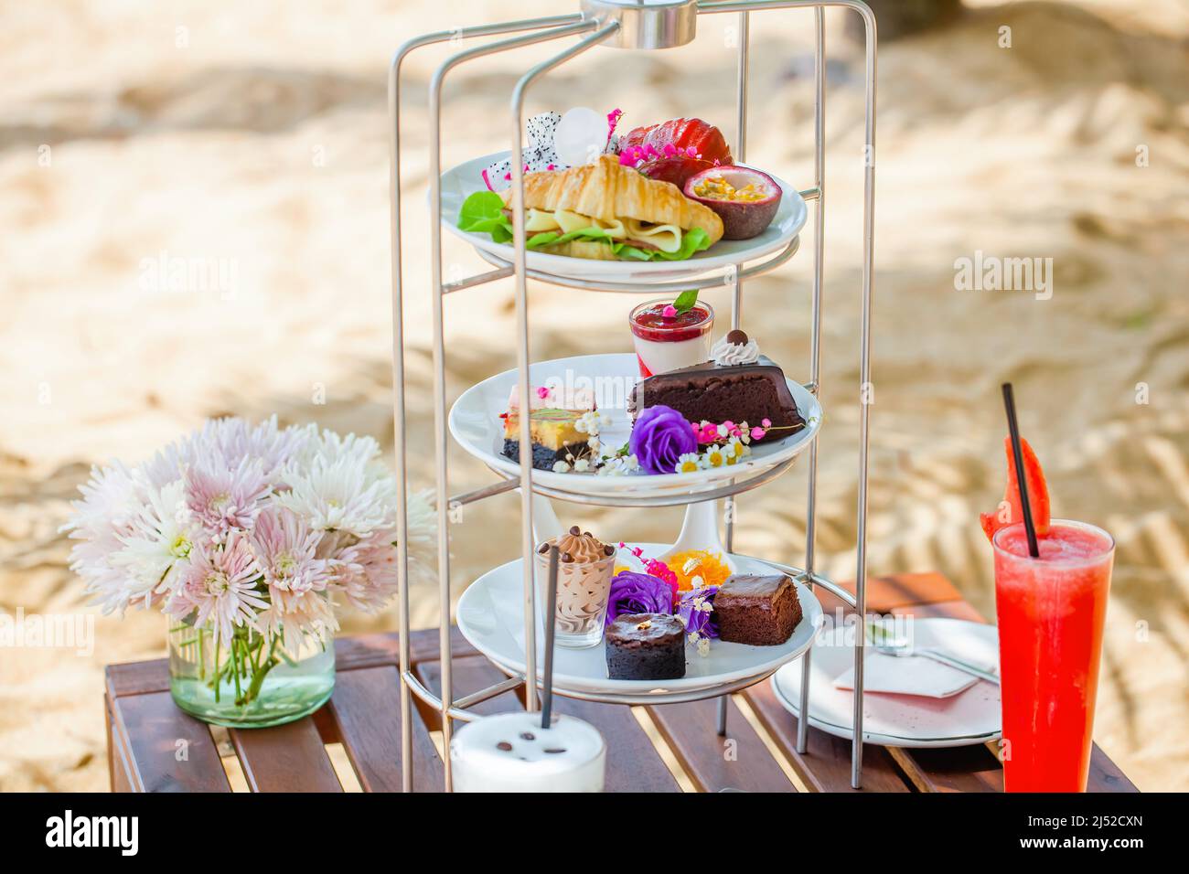 Afternoon tea on tropical sandy beach with shadows from palm trees in ...