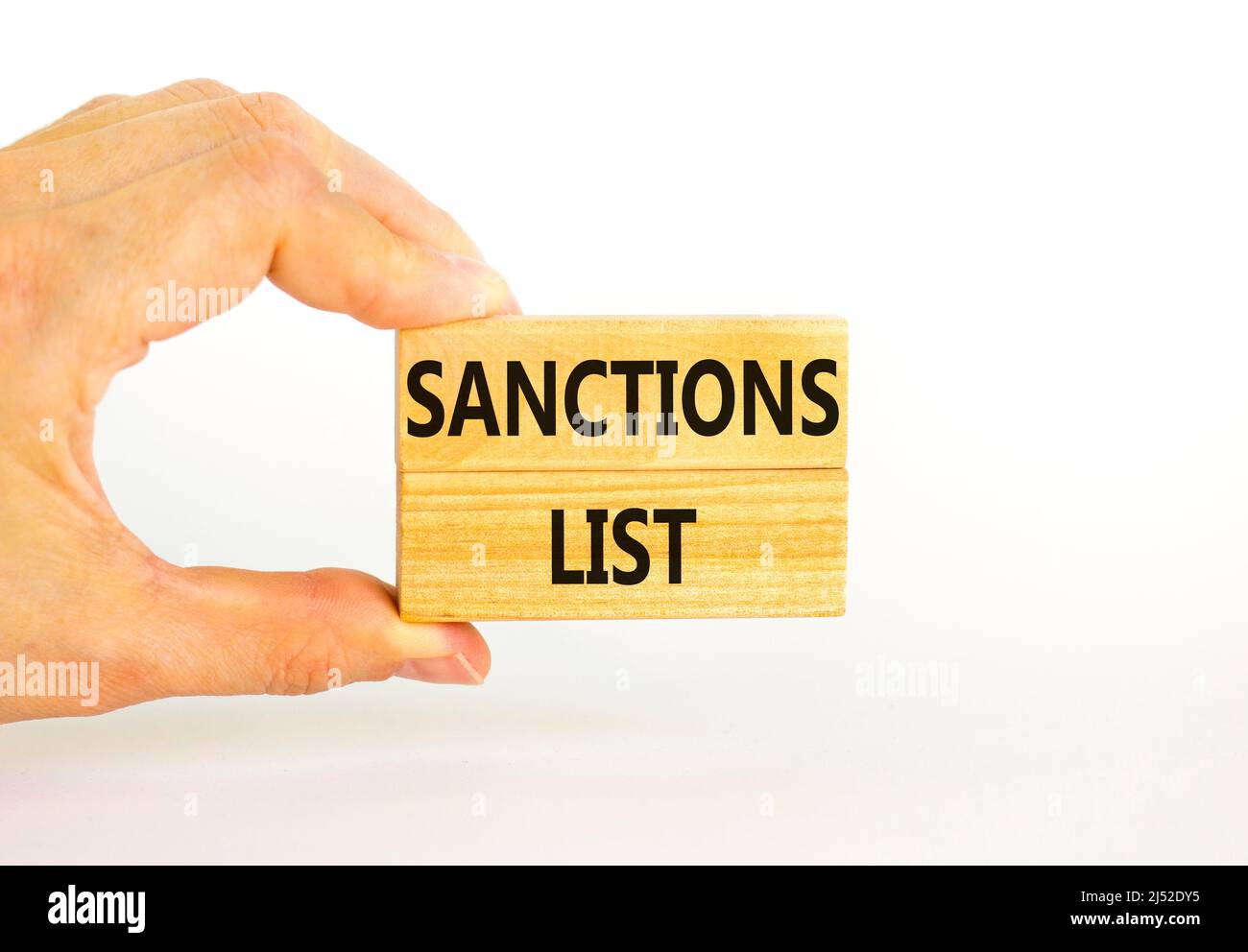 Sanctions list symbol. Wooden blocks with concept words Sanctions list ...