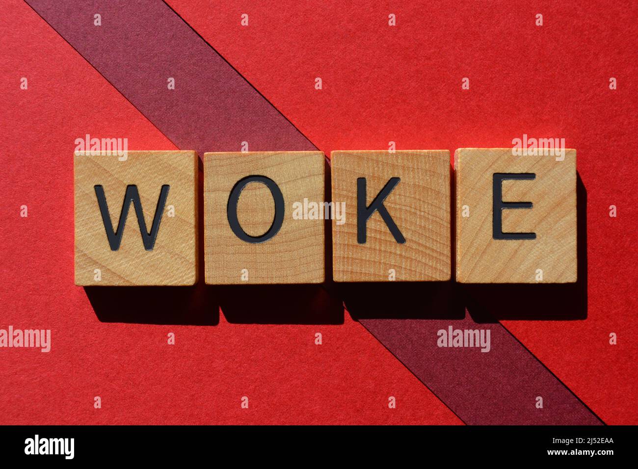 Woke, word in wooden alphabet letters isolated on red background Stock ...