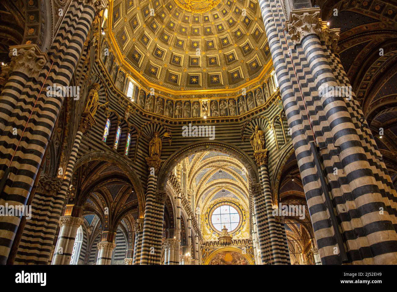 View of the interior of the Siena Cathedral. Dome with frescoes and ...