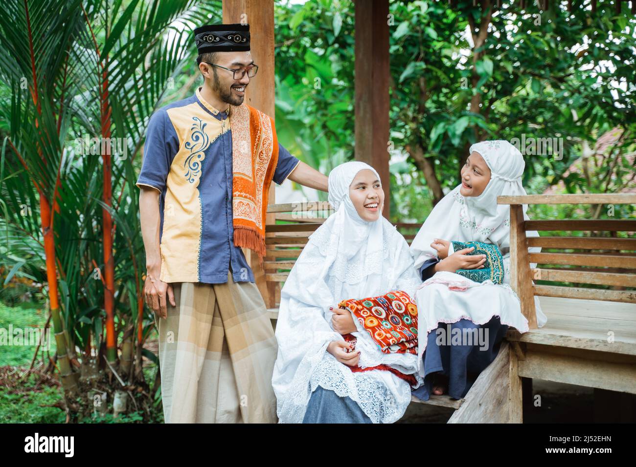 family muslim sitting in the garden and having a conversation Stock ...