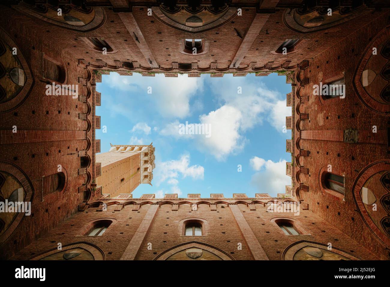 View of the Torre del Mangia (Mangia Tower) of Siena from inside the ...