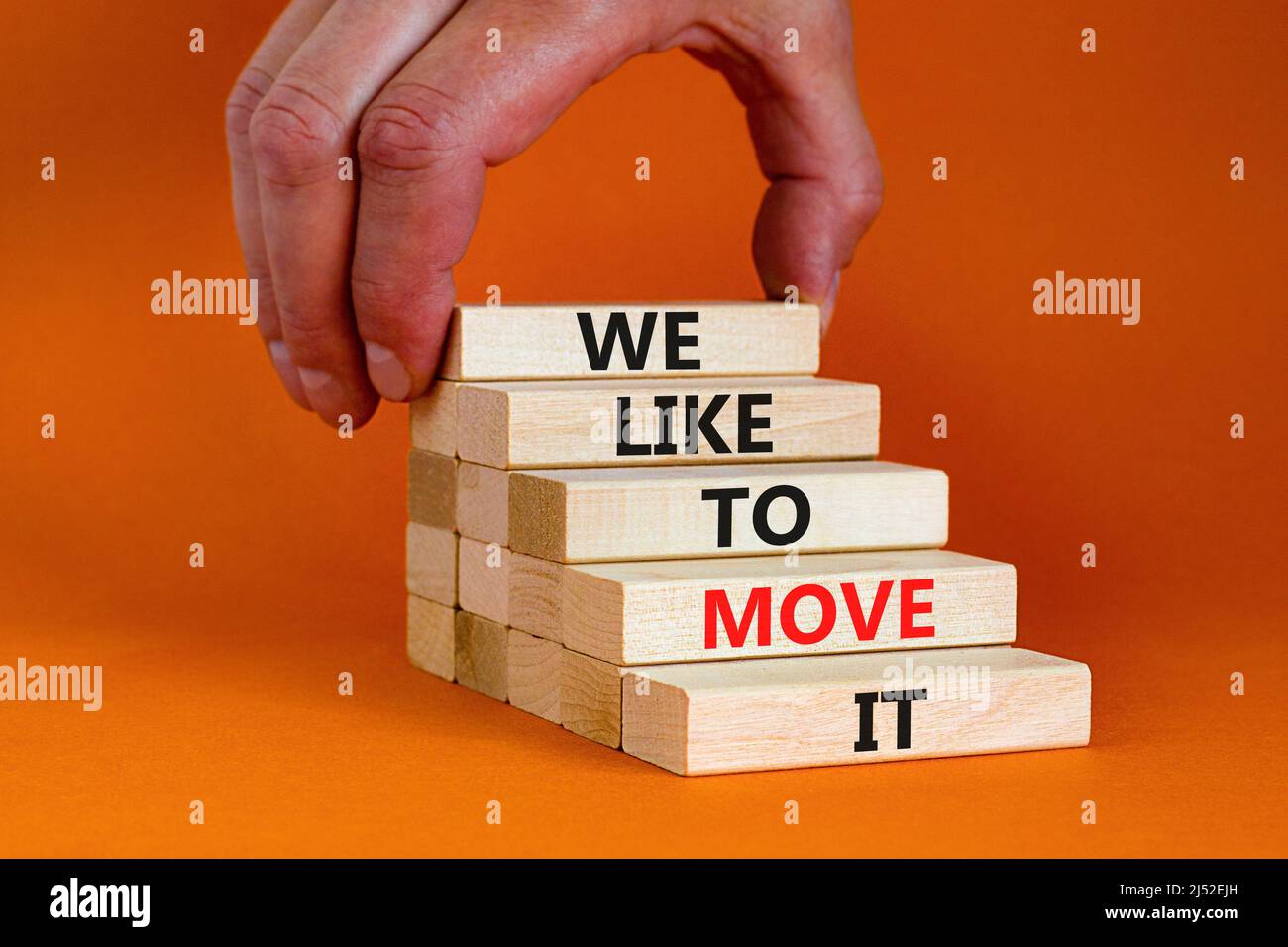 We like to move it symbol. Concept words We like to move it on wooden ...
