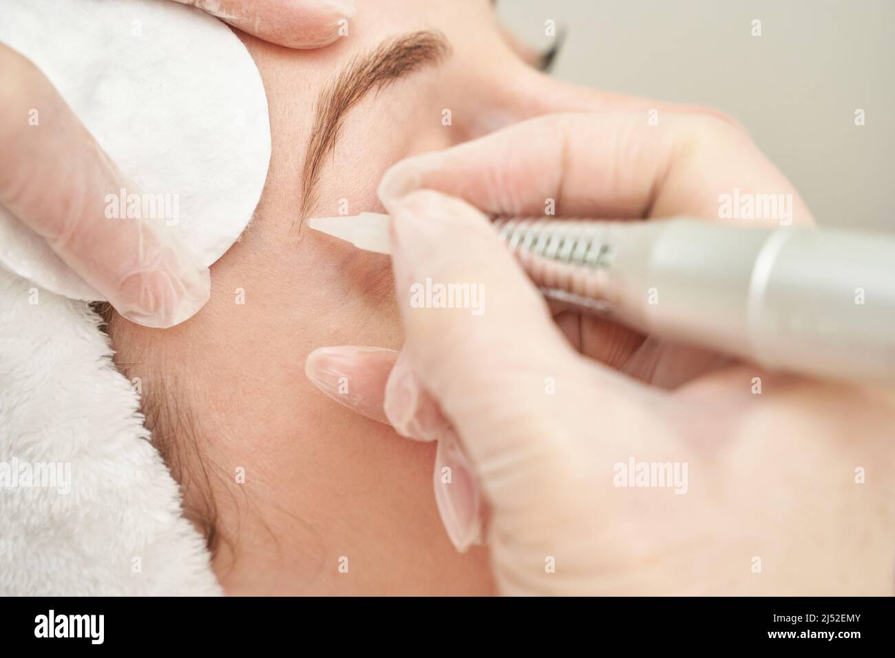 Permanent makeup. Beauty spa procedure. young woman. Face tattoo. Eye ...