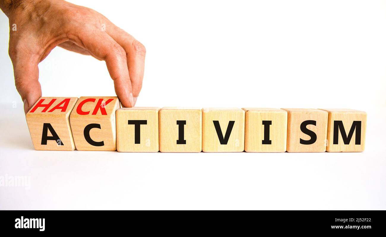 Activism or hacktivism symbol. Businessman turns wooden cubes and ...