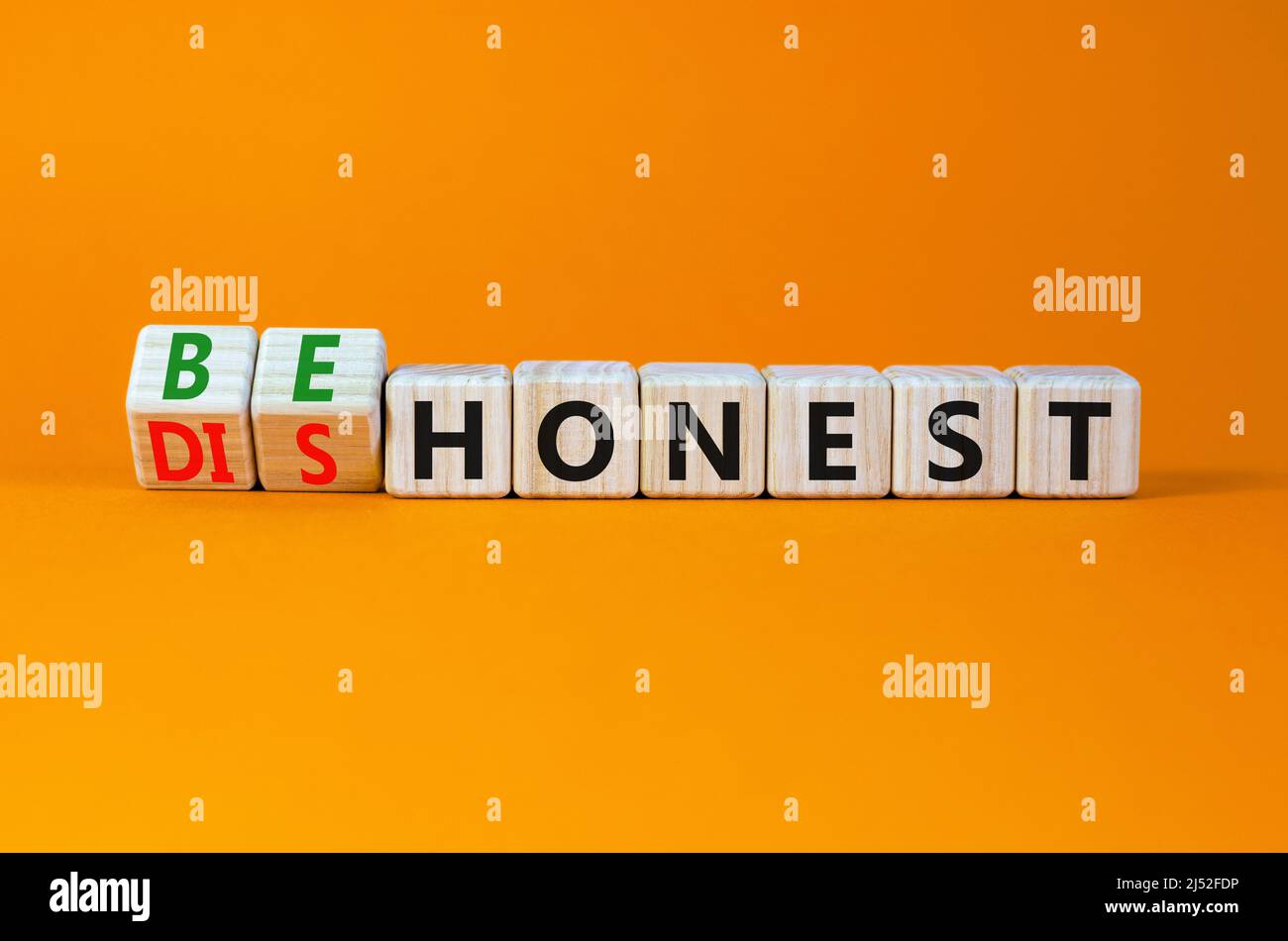 Be honest or dishonest symbol. Turned wooden cubes and changed concept ...