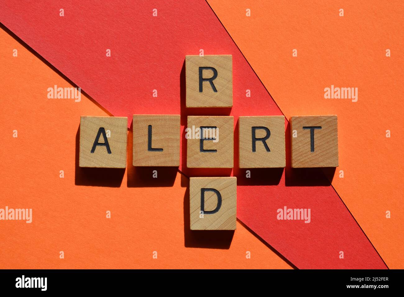 Red Alert, words in wooden alphabet letters in crossword form isolated ...