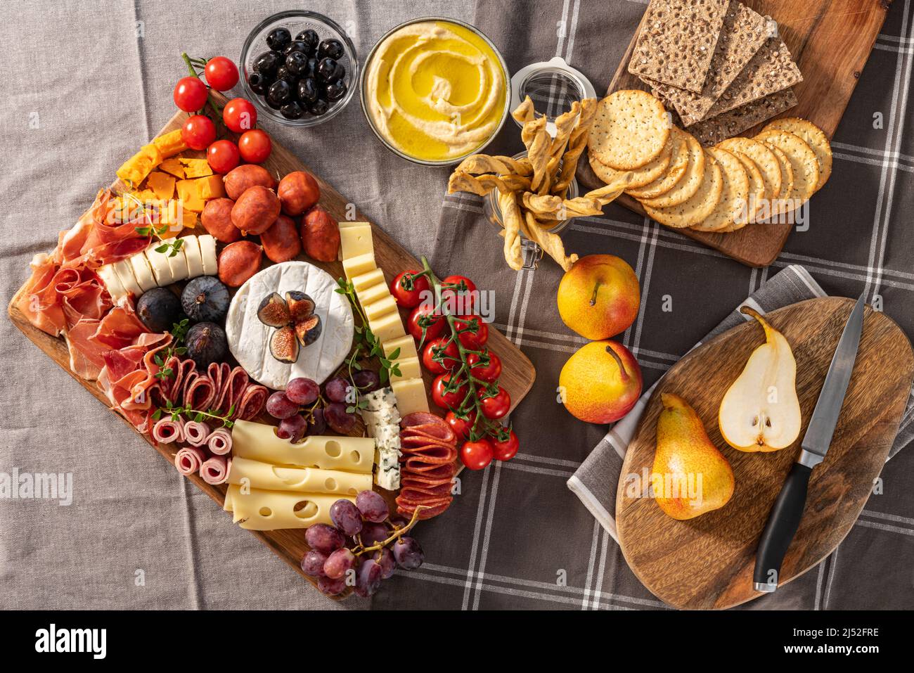 Cured cheese and meze platter setup rich in variety of fruits, cheese ...