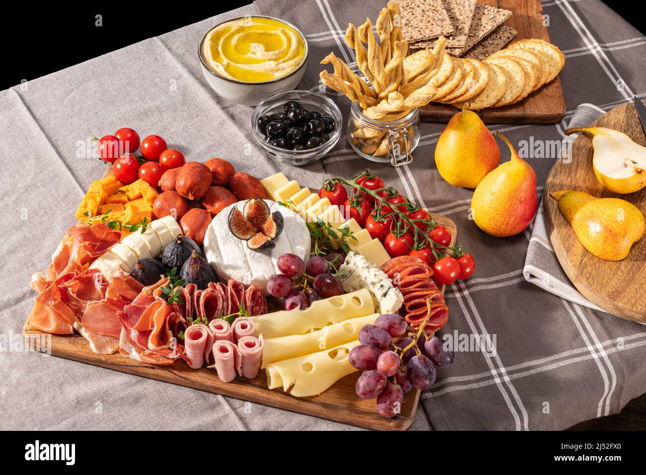 Cured cheese and meze platter setup rich in variety of fruits, cheese ...