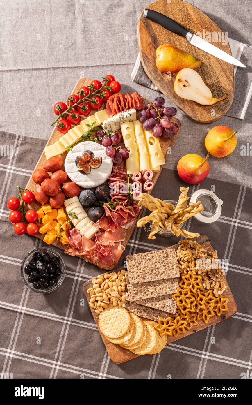Cured cheese and meze platter setup rich in variety of fruits, cheese ...