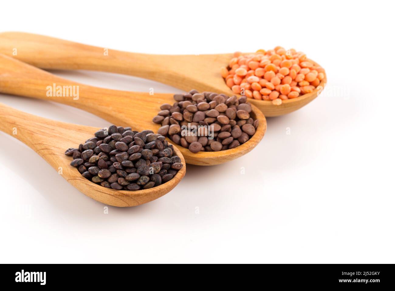 Various lentils in wooden spoons isolated on white background. Collection Stock Photo - Alamy