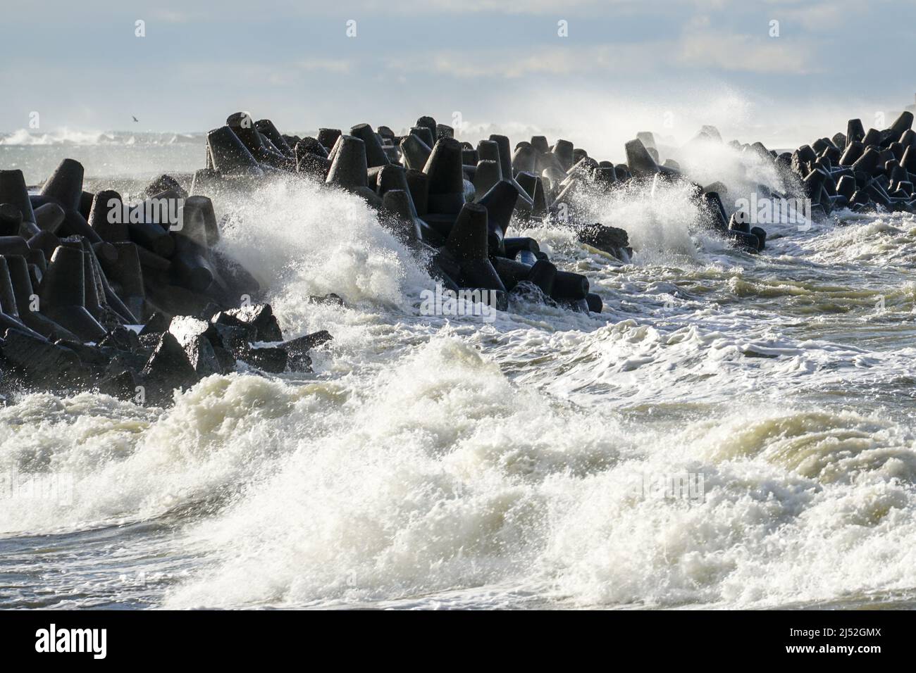 coastal storm in the Baltic Sea, big waves crash against the concrete ...
