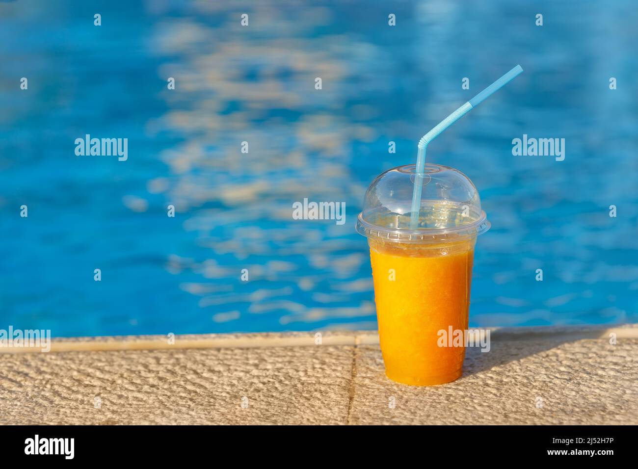 fresh mango juice or smoothie near the pool Stock Photo - Alamy