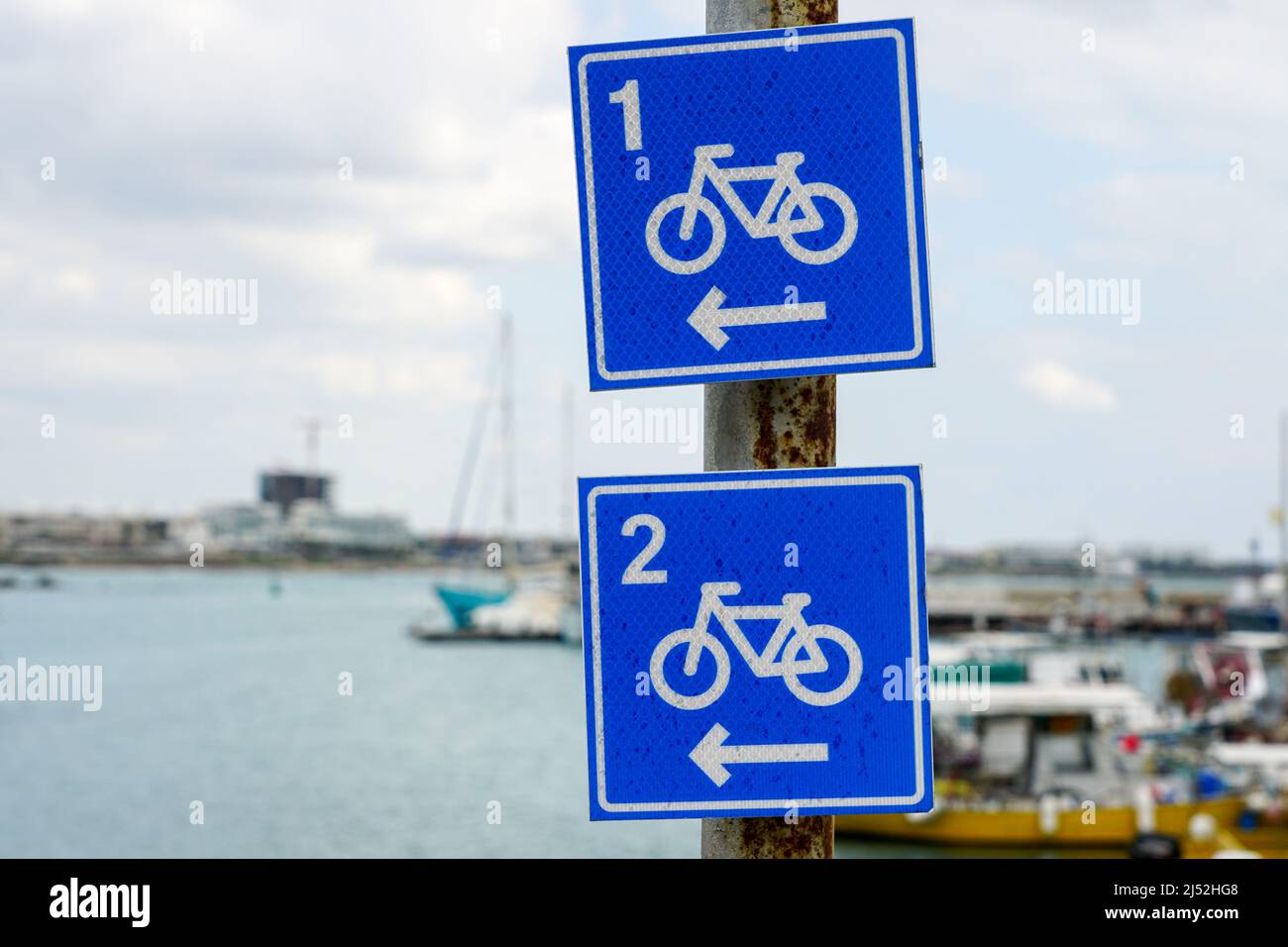 blue square shaped bicycle lane route signs with route numbers on a ...