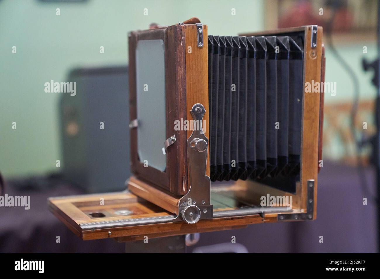 Side view of the old camera on the background of the table. An old ...