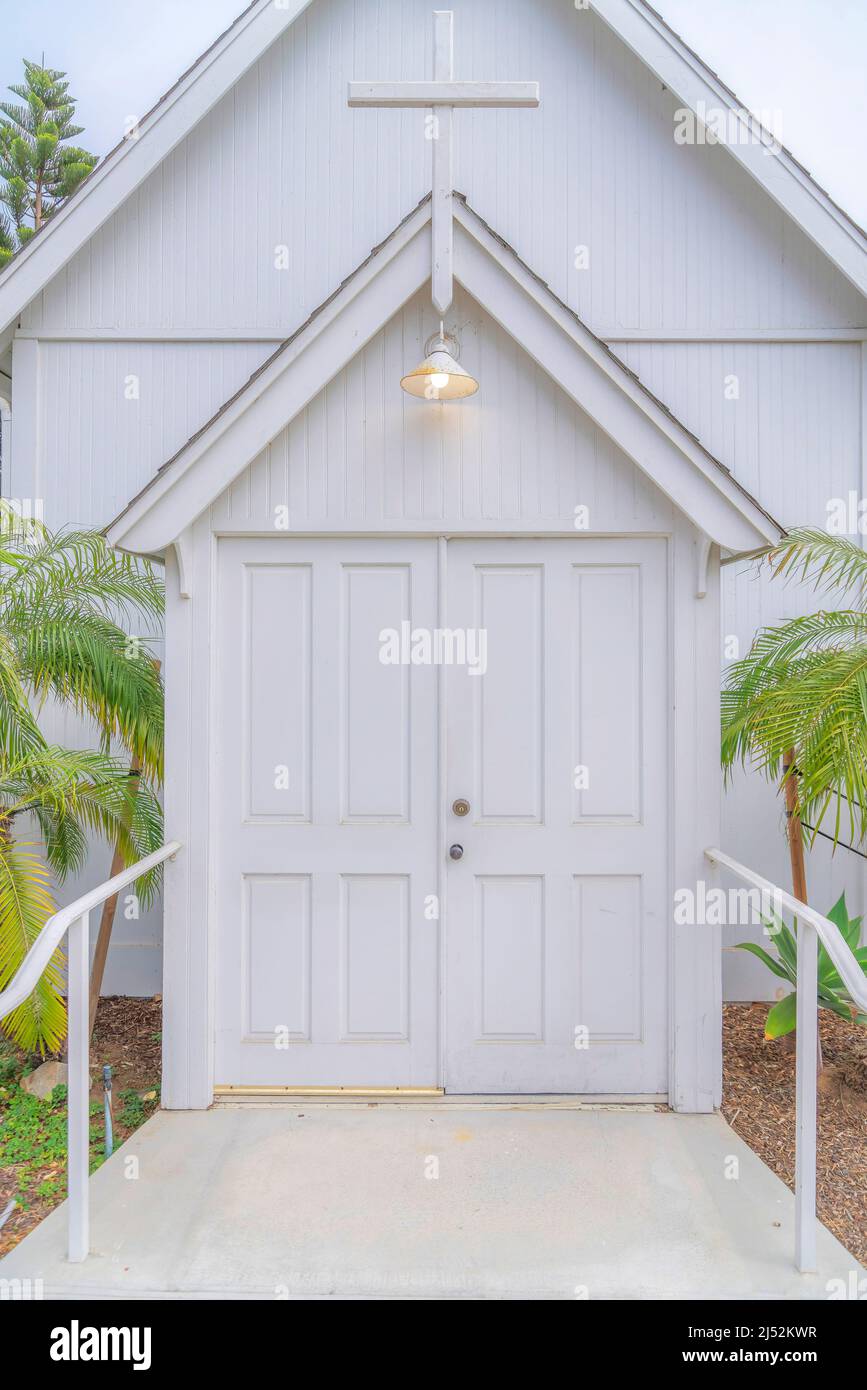 Entrance of a small white chapel with railings at Carlsbad, San Diego ...