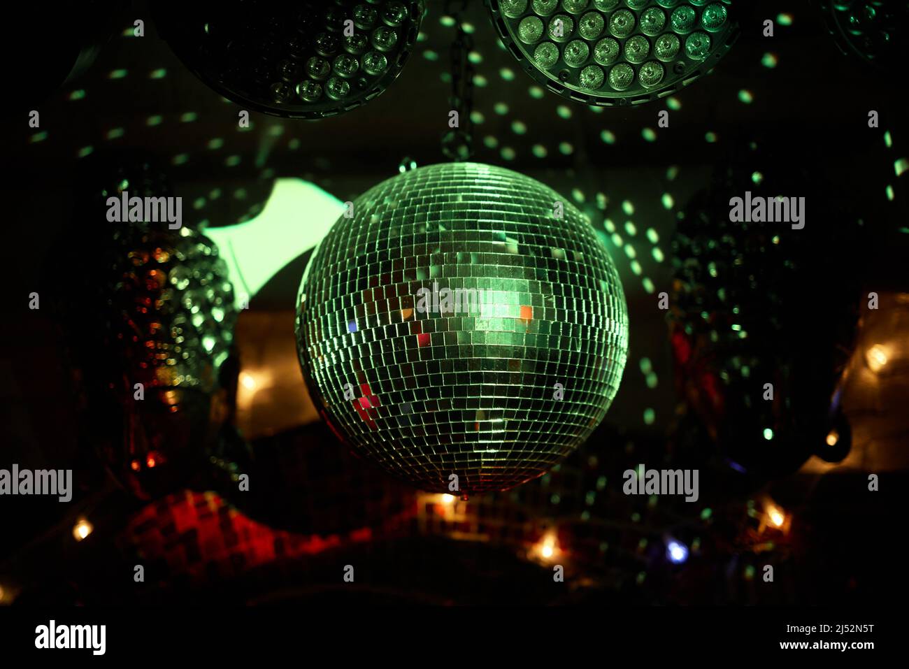 Colorful disco mirror ball lights night club background Stock Photo - Alamy