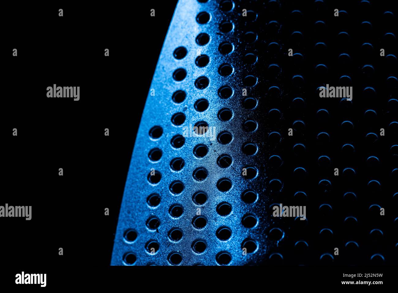 Closeup of a kitchen utensil with small holes Stock Photo - Alamy