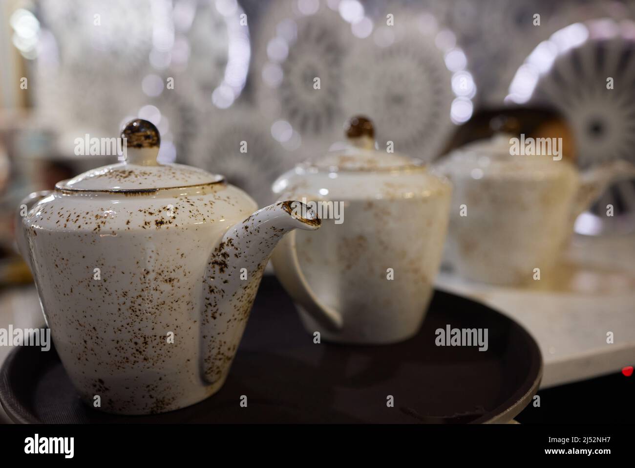 a set of teapots with small cups that are unique and classic Stock ...