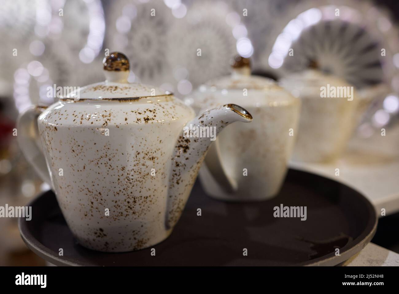 a set of teapots with small cups that are unique and classic Stock ...