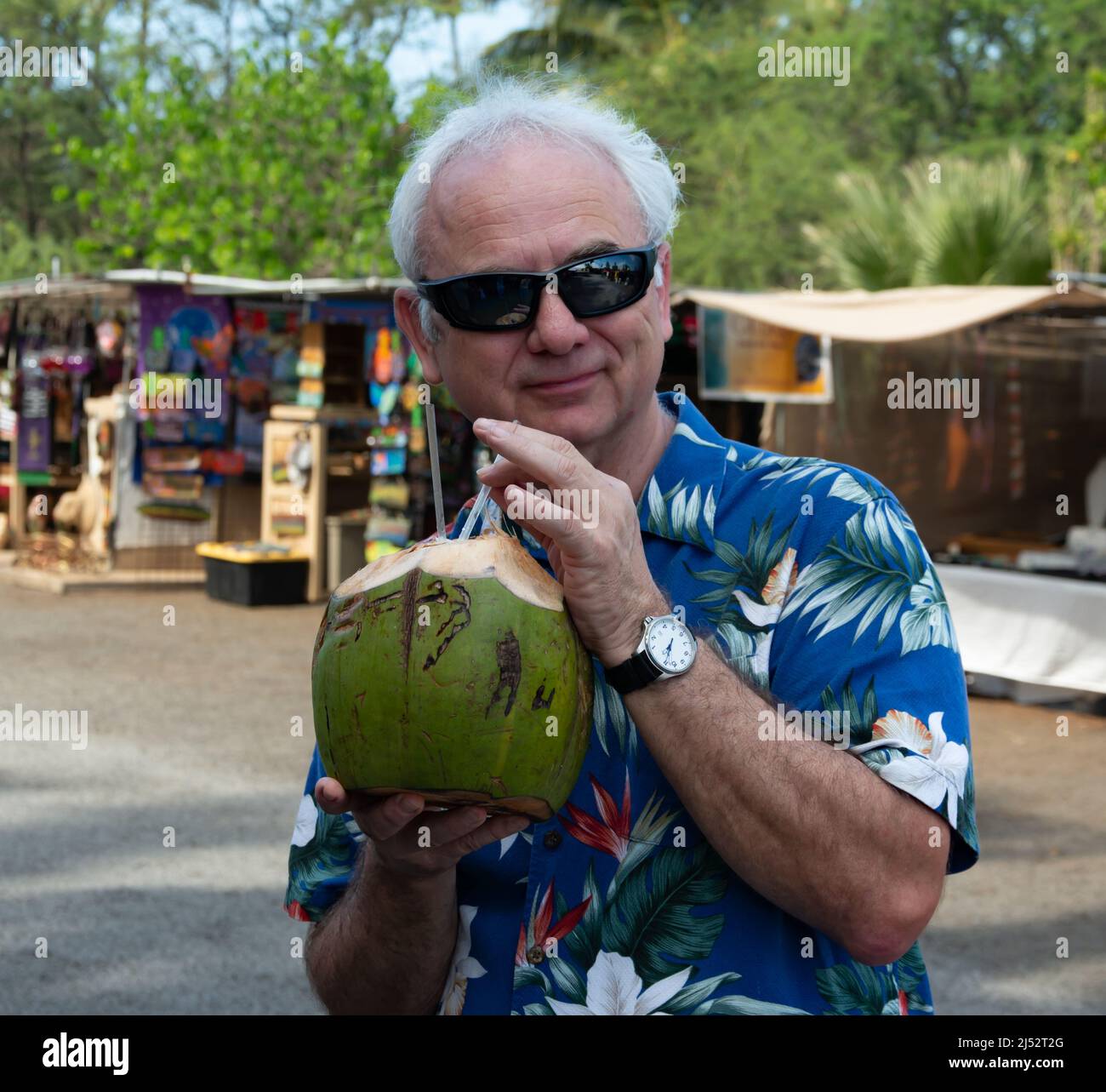 Hawaii coconut drinking hi-res stock photography and images - Alamy