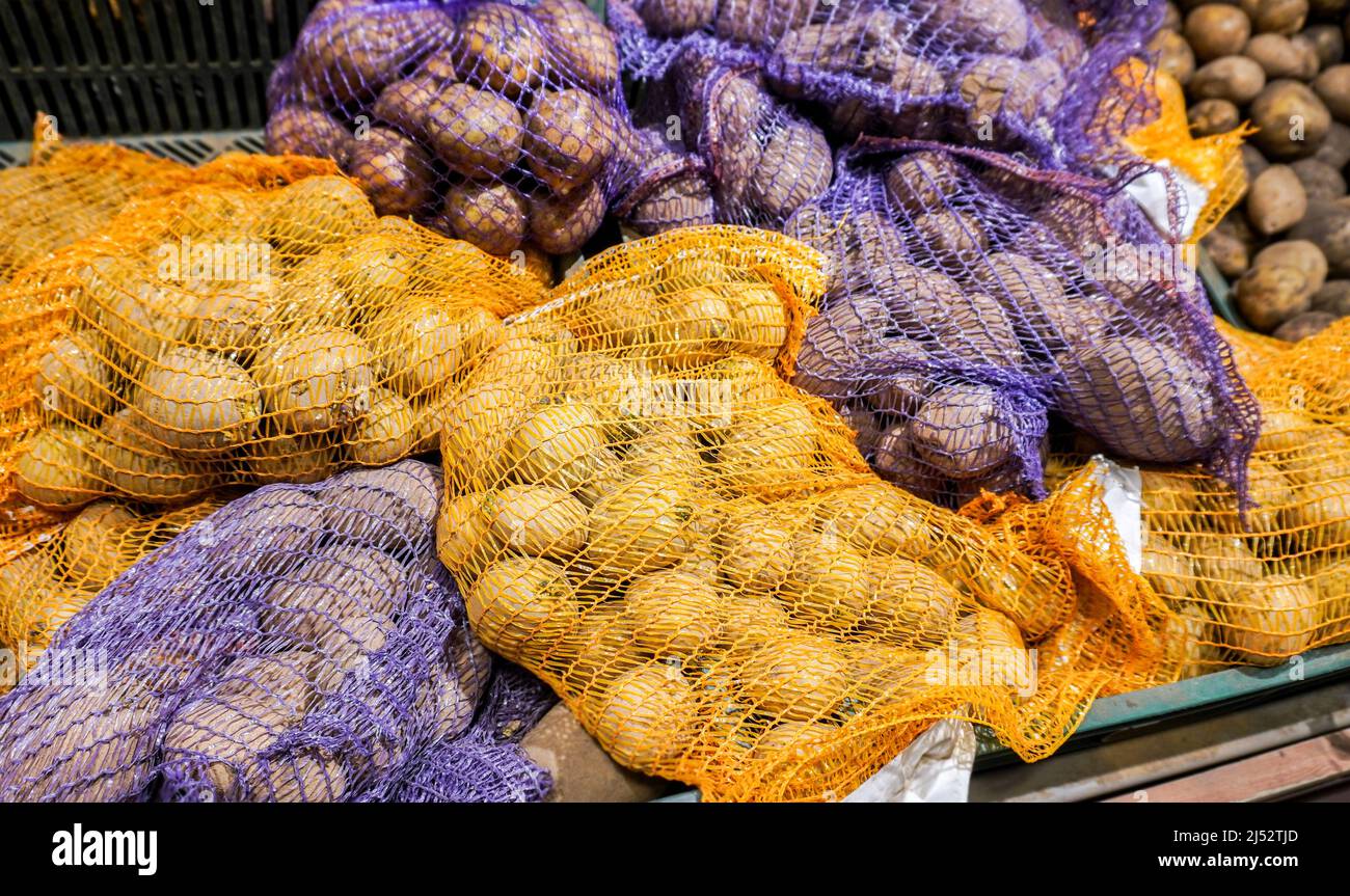 Fresh potatoes packed in bags sold in a superstore Stock Photo - Alamy