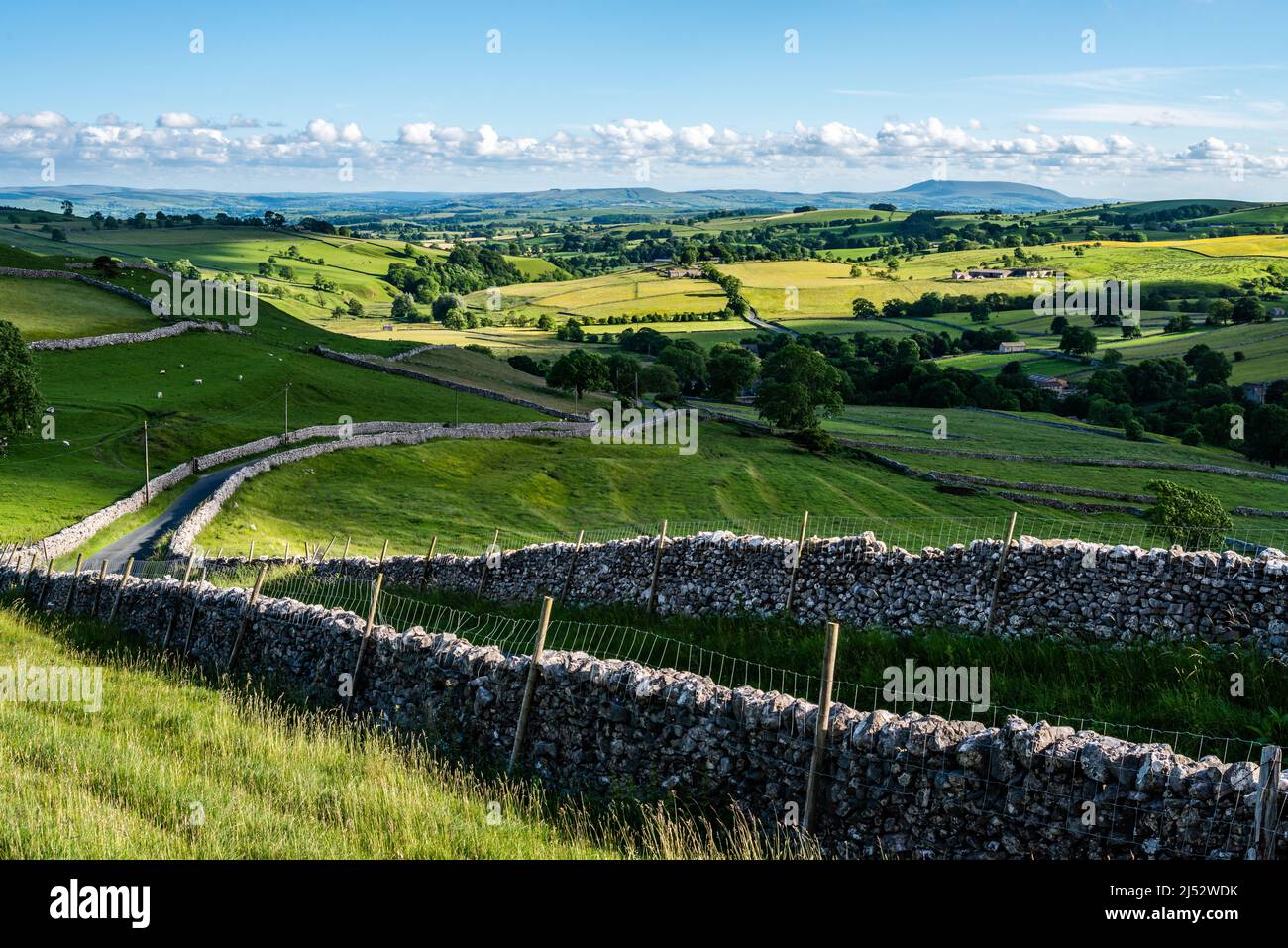 Road through countryside to Malham, North Yorkshire, England, UK Stock ...