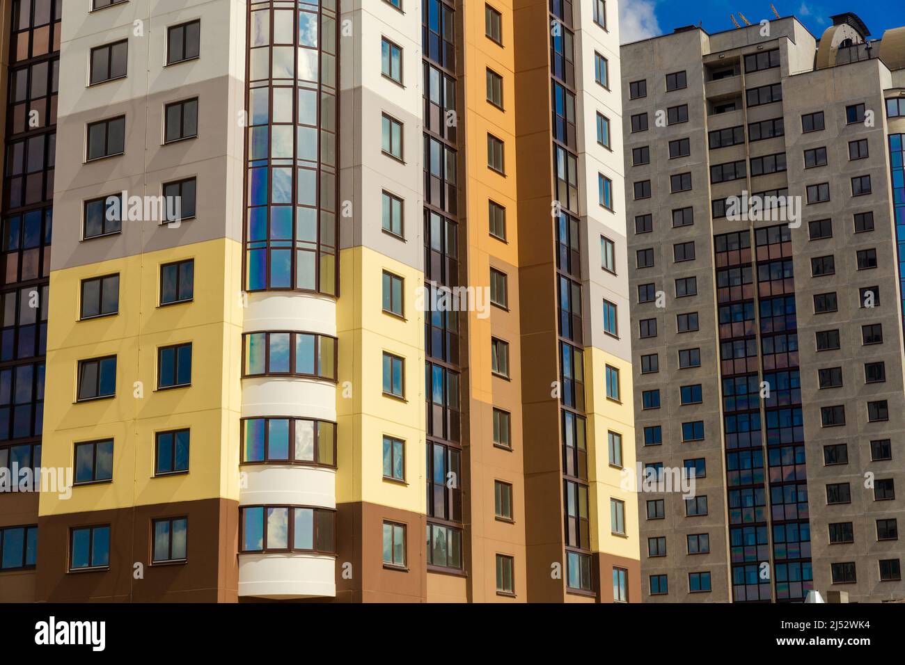 The background of the mirrored facade of a multi-storey residential ...