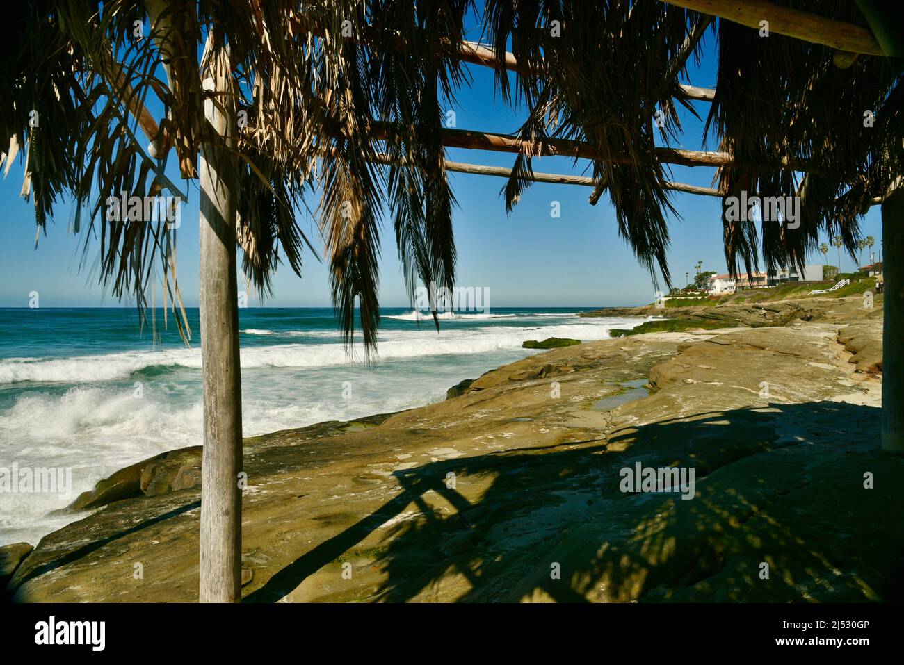 Historic landmark Windansea Surf Shack adjacent to waves and surf along ...