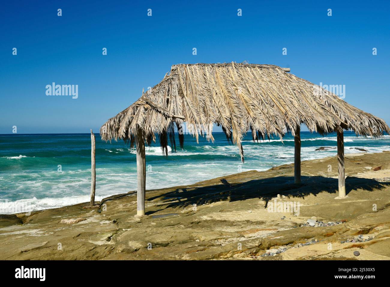 Historic landmark Windansea Surf Shack adjacent to waves and surf along ...