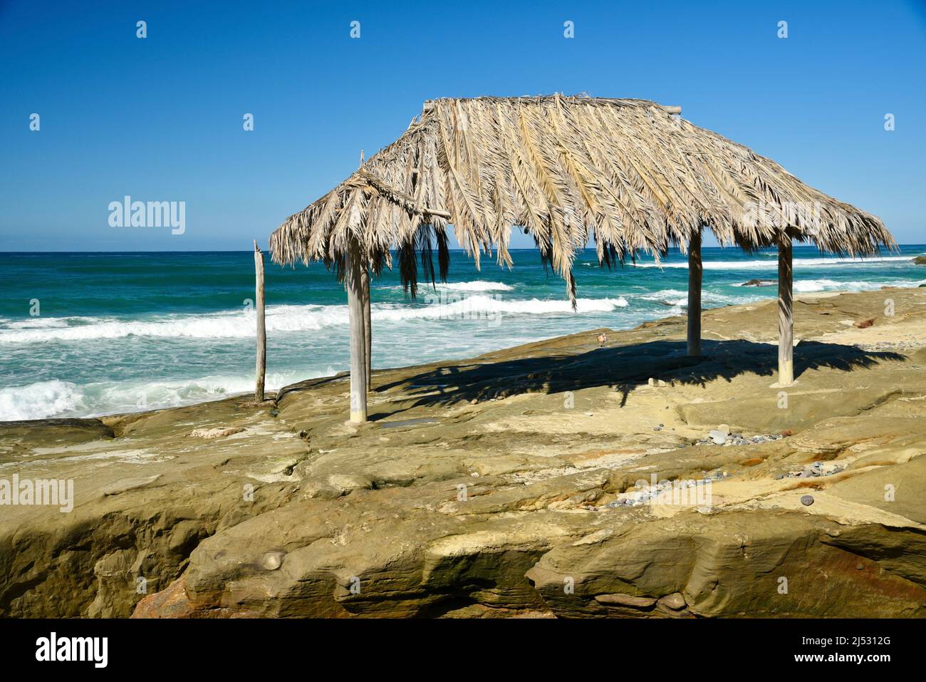 Historic landmark Windansea Surf Shack adjacent to waves and surf along ...
