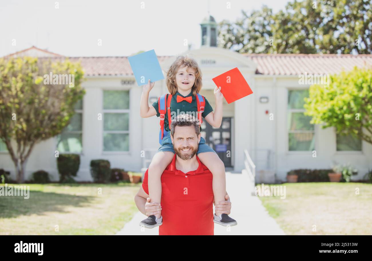 Father walking son to school. Parent get a son pupil piggyback ride ...