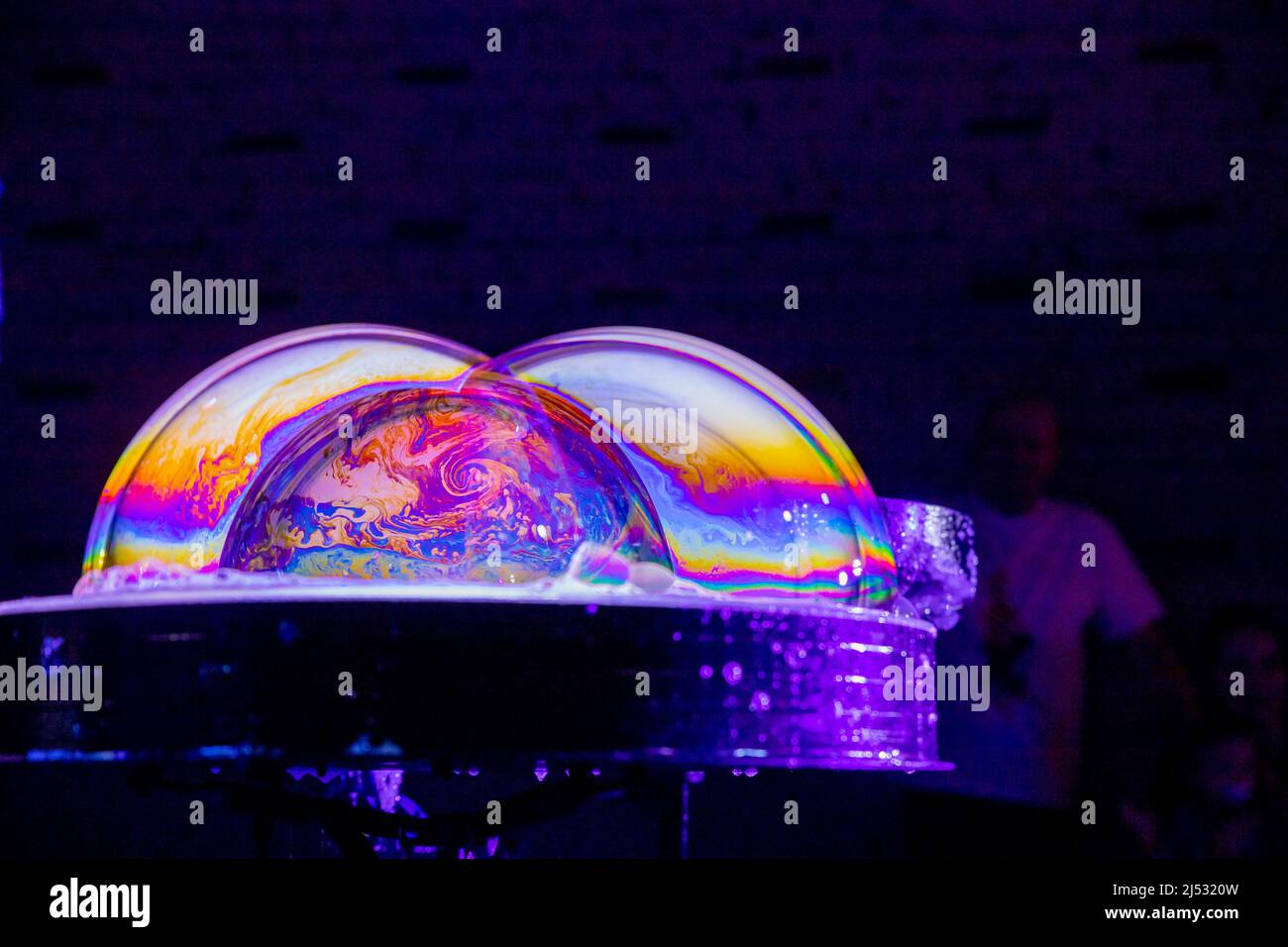 Artist blowing many soap bubble from his hands bubble show Stock Photo ...