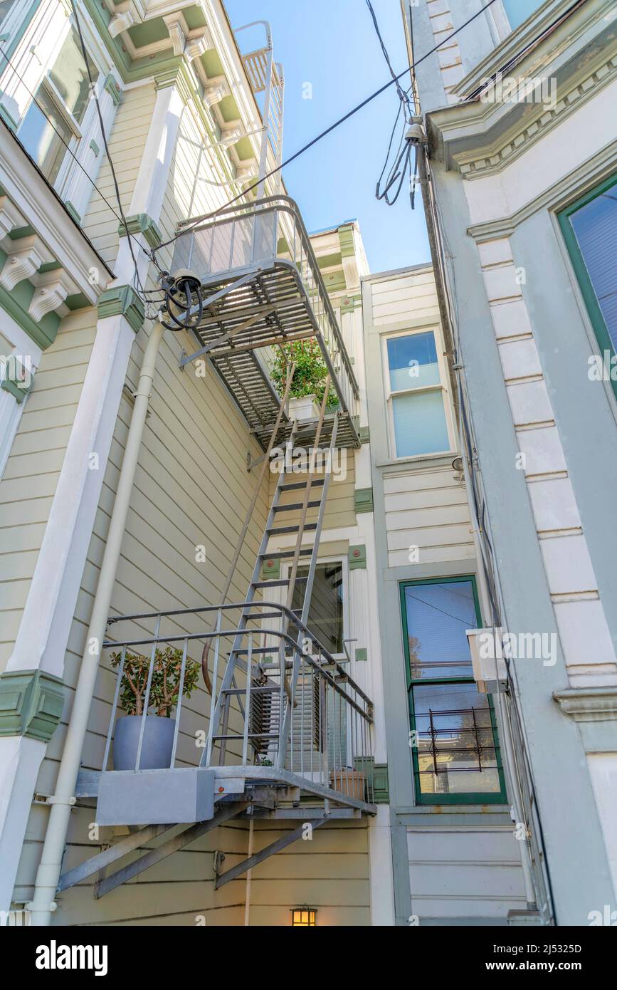 Emergency stairs exit on the side of an apartment building with light ...