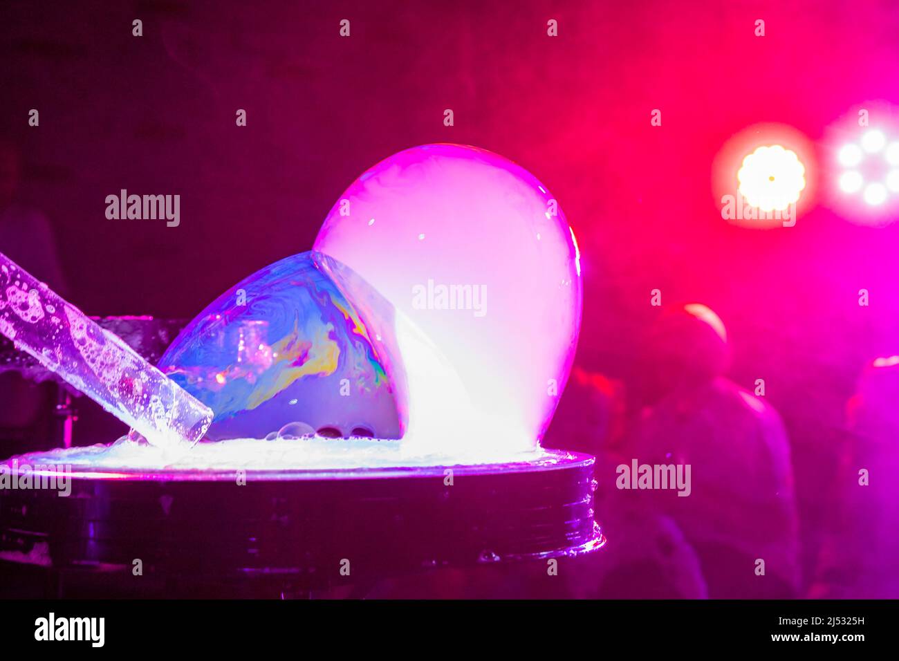 Artist blowing many soap bubble from his hands bubble show Stock Photo ...