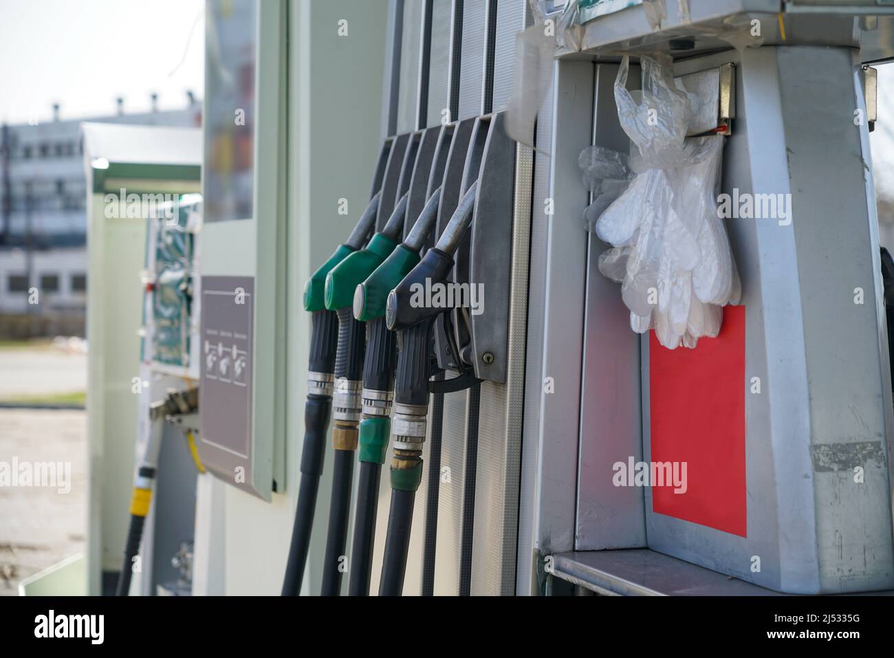 Refueling pistol at a gas station. Close-up Stock Photo - Alamy