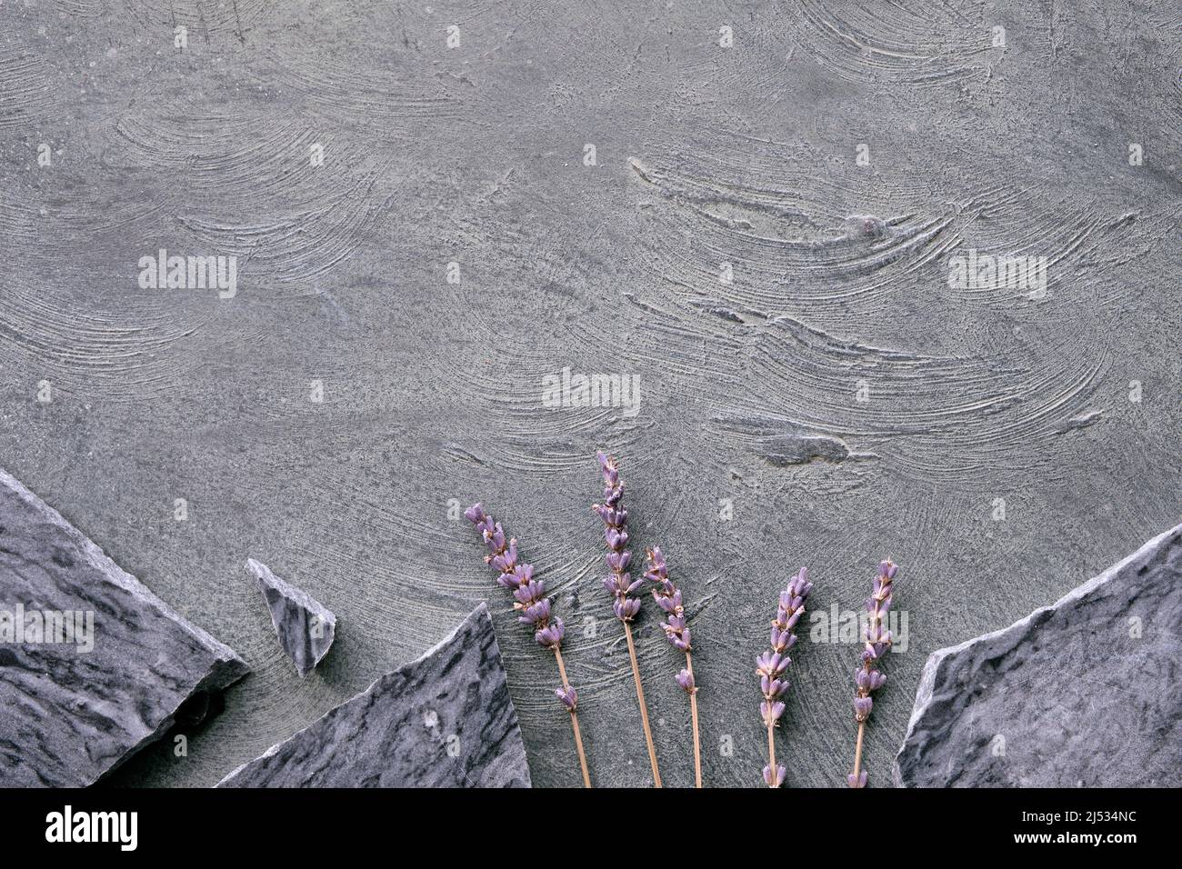 Layered flat stone background with broken pieces of granite plate and ...