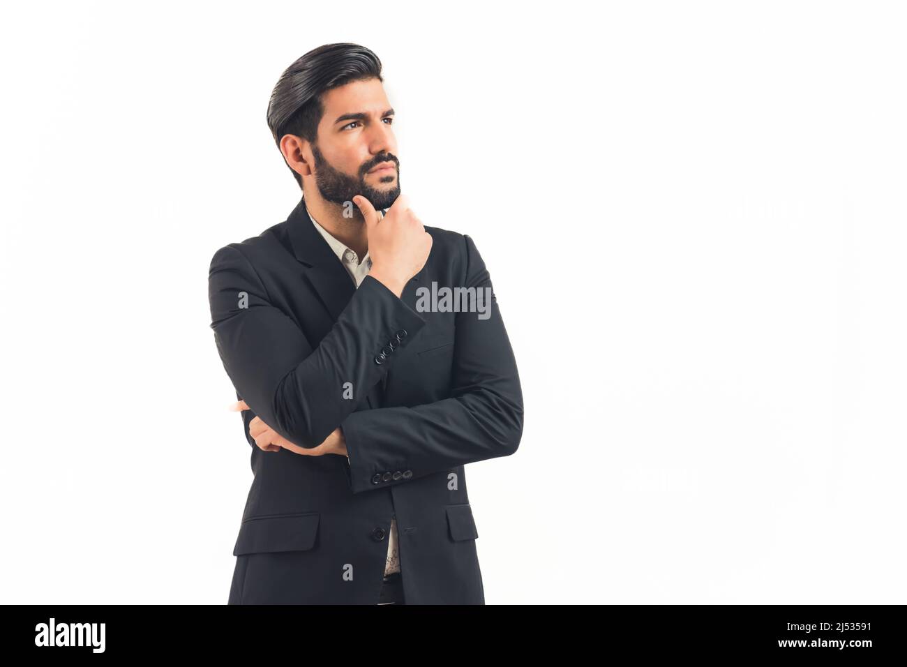 Handsome bearded young man holding his chin, guy wearing suit, isolated ...