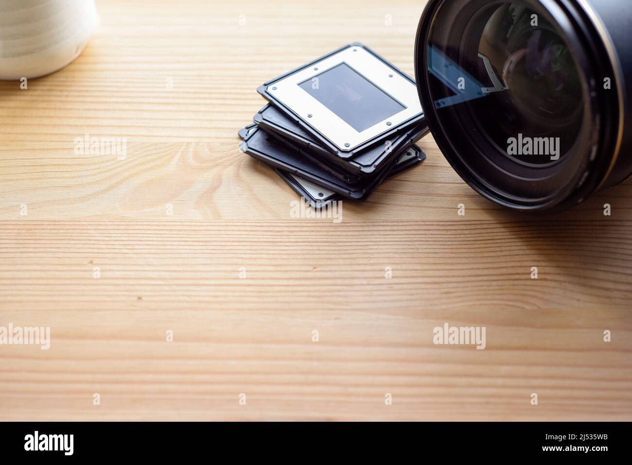 Camera lens and photographic slides for film projector Stock Photo - Alamy